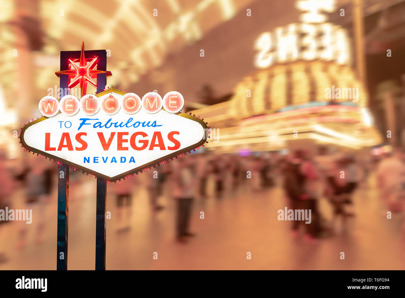 Famous Las Vegas sign with blur cityscape Stock Photo - Alamy