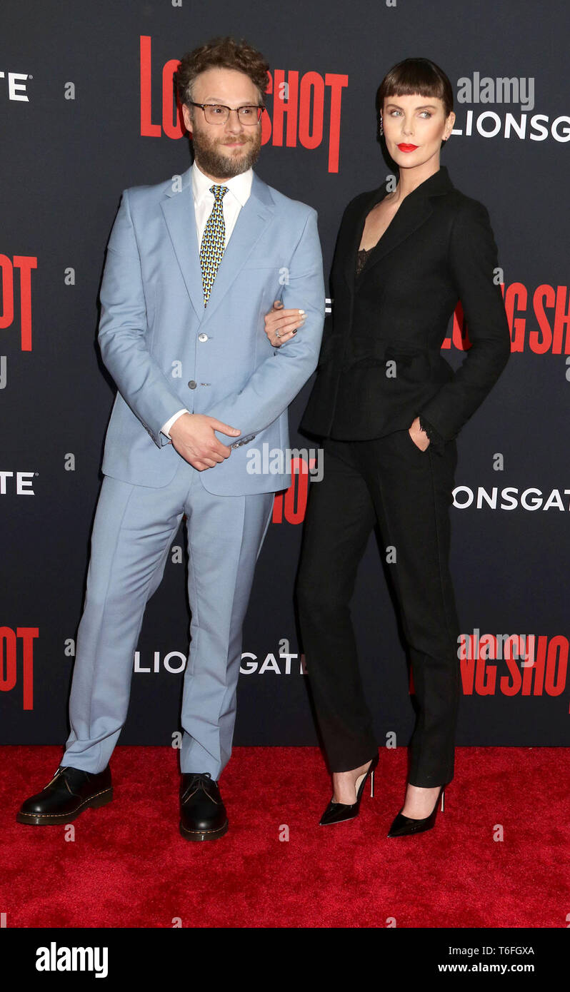 Long shot seth rogen charlize theron hi-res stock photography and ...