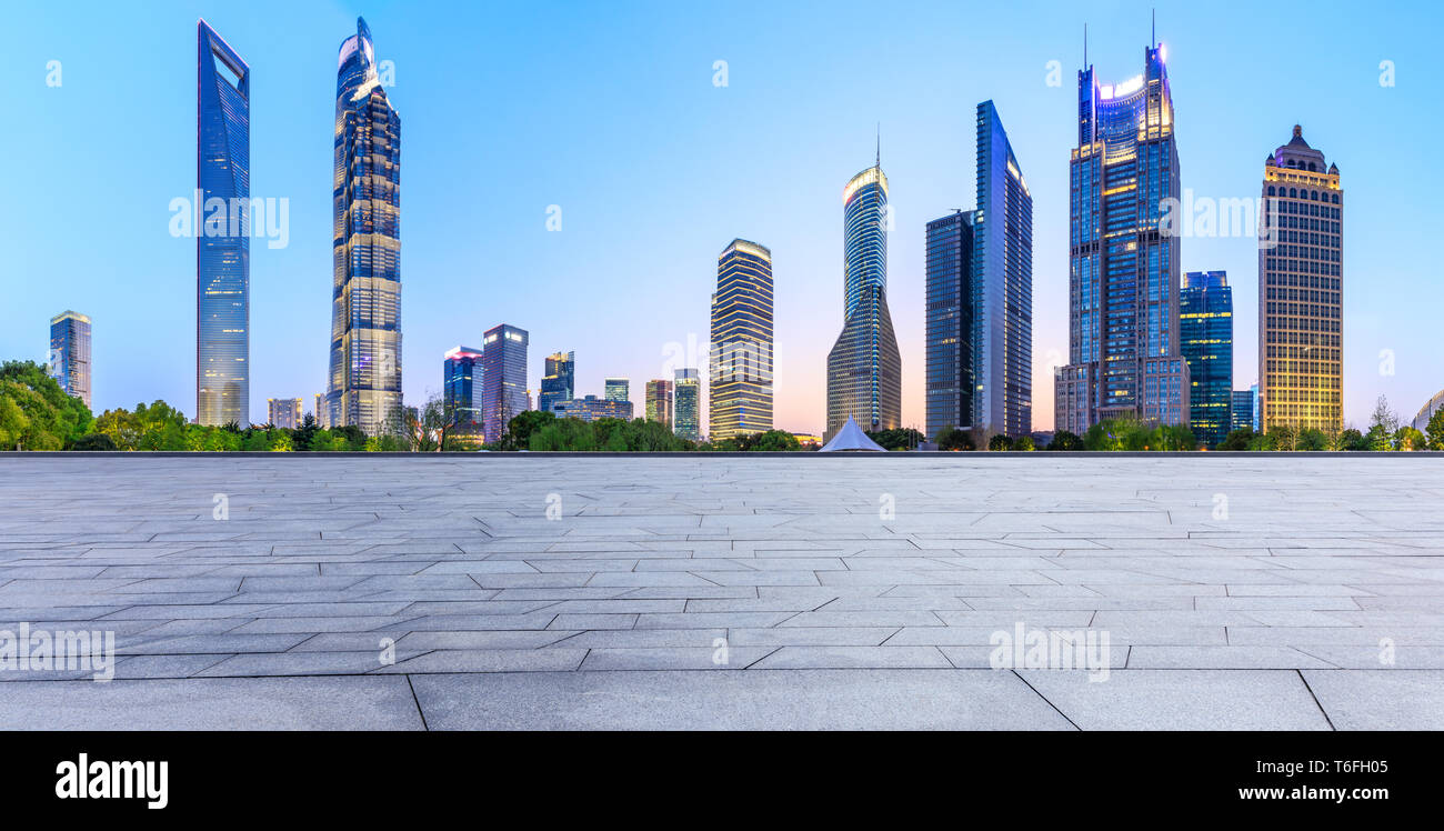 Shanghai modern commercial office buildings and square floor at night ...