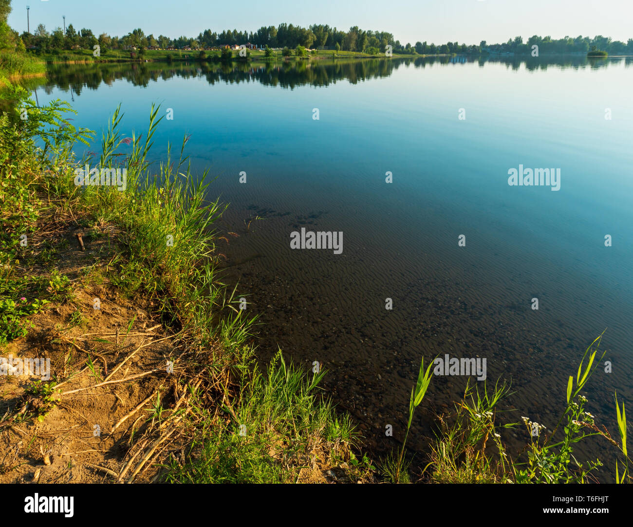Summer sunset lake calm beach Stock Photo - Alamy