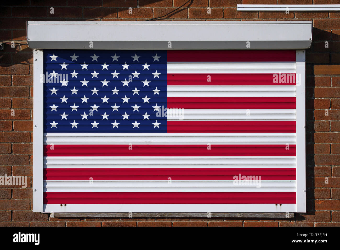 American flag on closed steel security shutters Stock Photo - Alamy