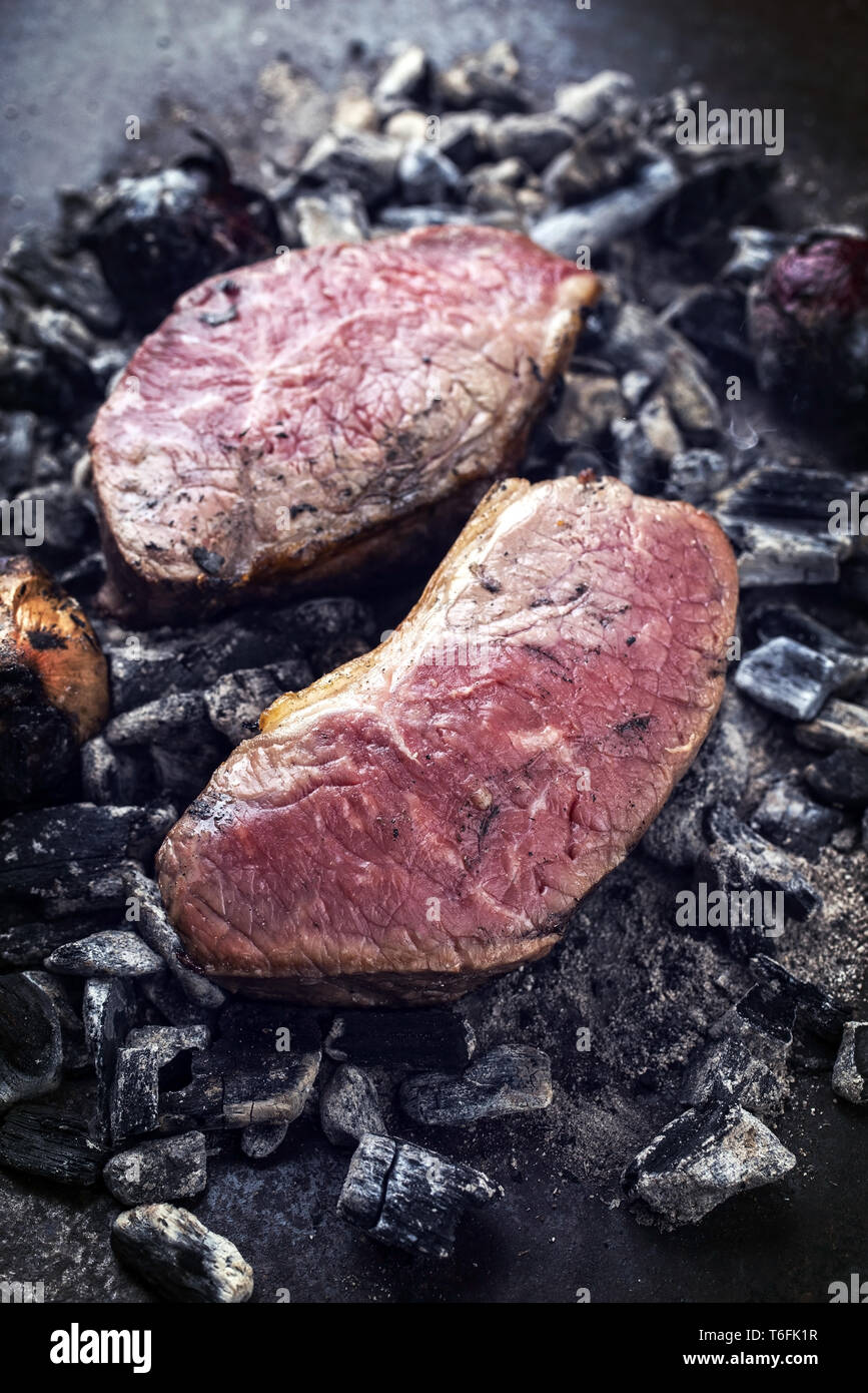 Barbecue caveman wagyu roast beef as top view on charcoal Stock Photo ...