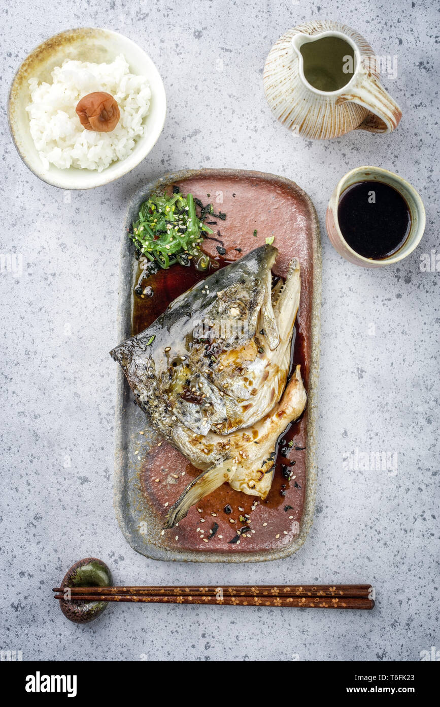 Traditional barbecue Japanese Kama Yaki broiled salmon fish head with ...