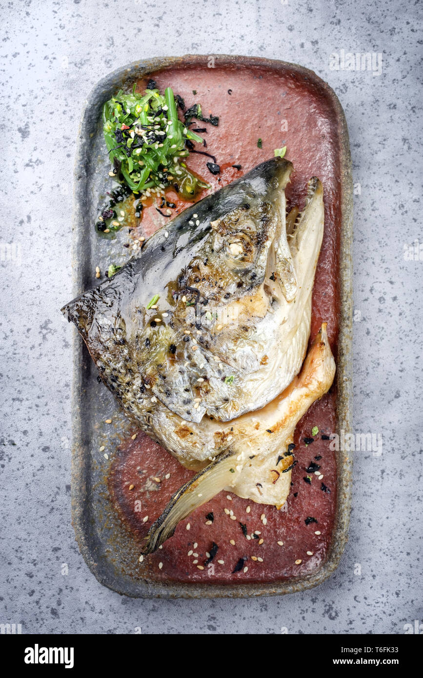 Traditional barbecue Japanese Kama Yaki broiled salmon fish head with ...