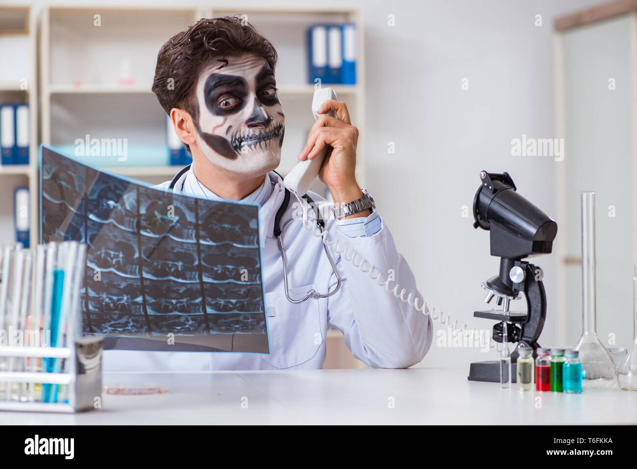 Scary monster doctor working in lab Stock Photo - Alamy