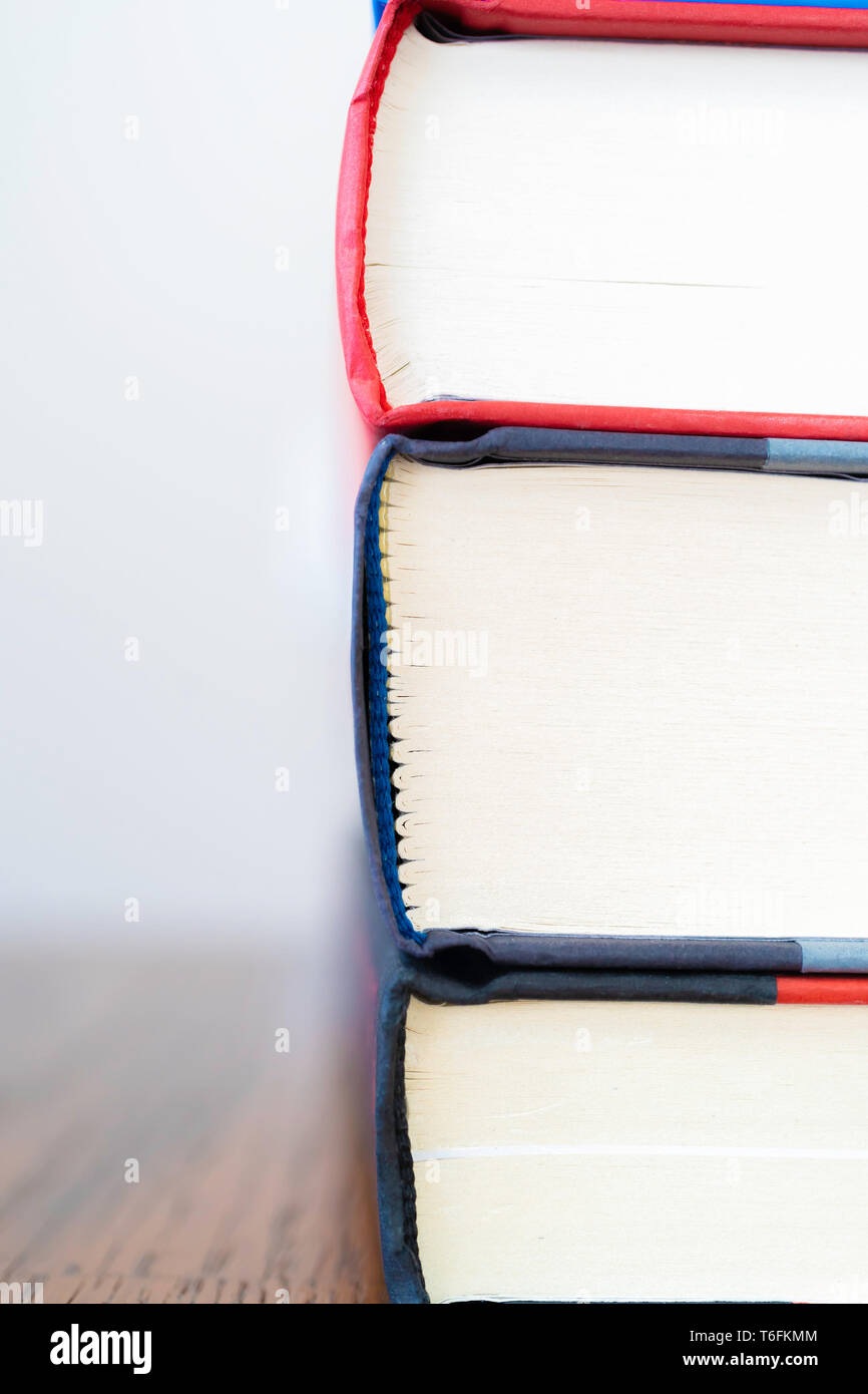 Stack of hardcover books in Library for reading Stock Photo - Alamy