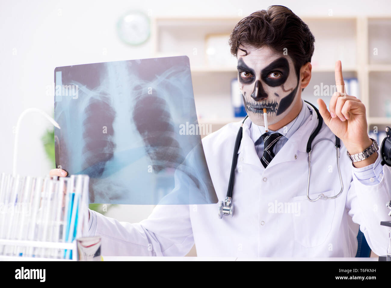 Scary monster doctor working in lab Stock Photo - Alamy