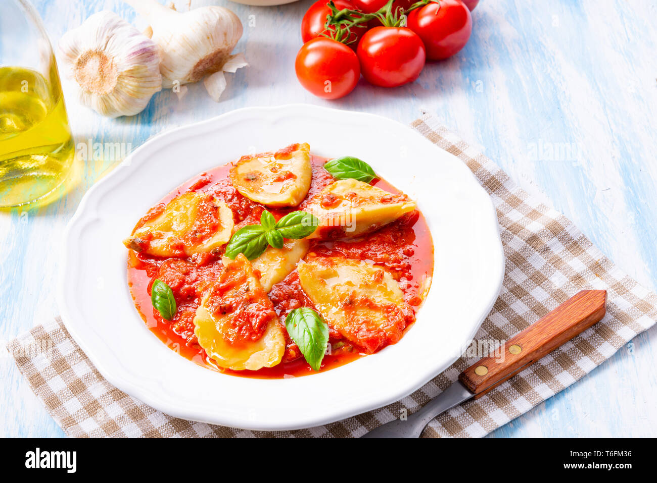 Delicious pasta - ravioli in tomato sauce with basil Stock Photo - Alamy