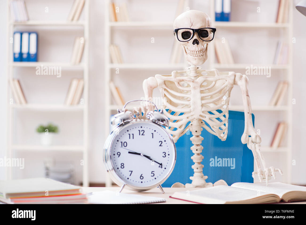 Skeleton businessman working in the office Stock Photo - Alamy