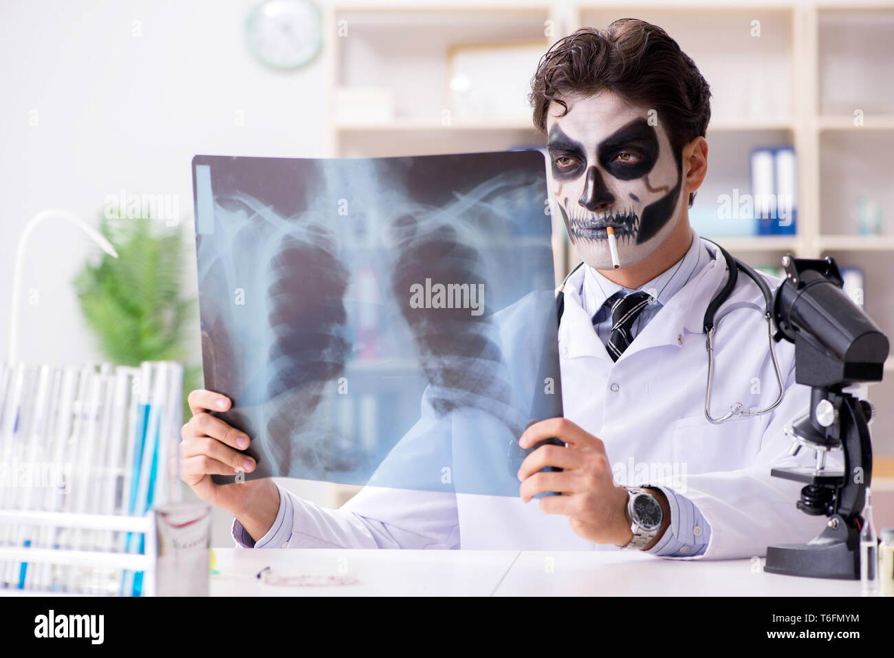 Scary monster doctor working in lab Stock Photo - Alamy