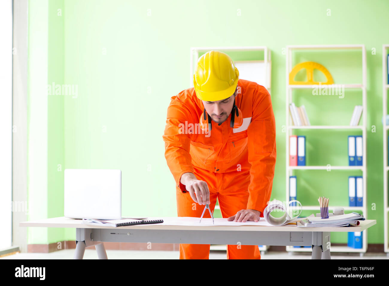 Construction supervisor planning new project in office Stock Photo - Alamy