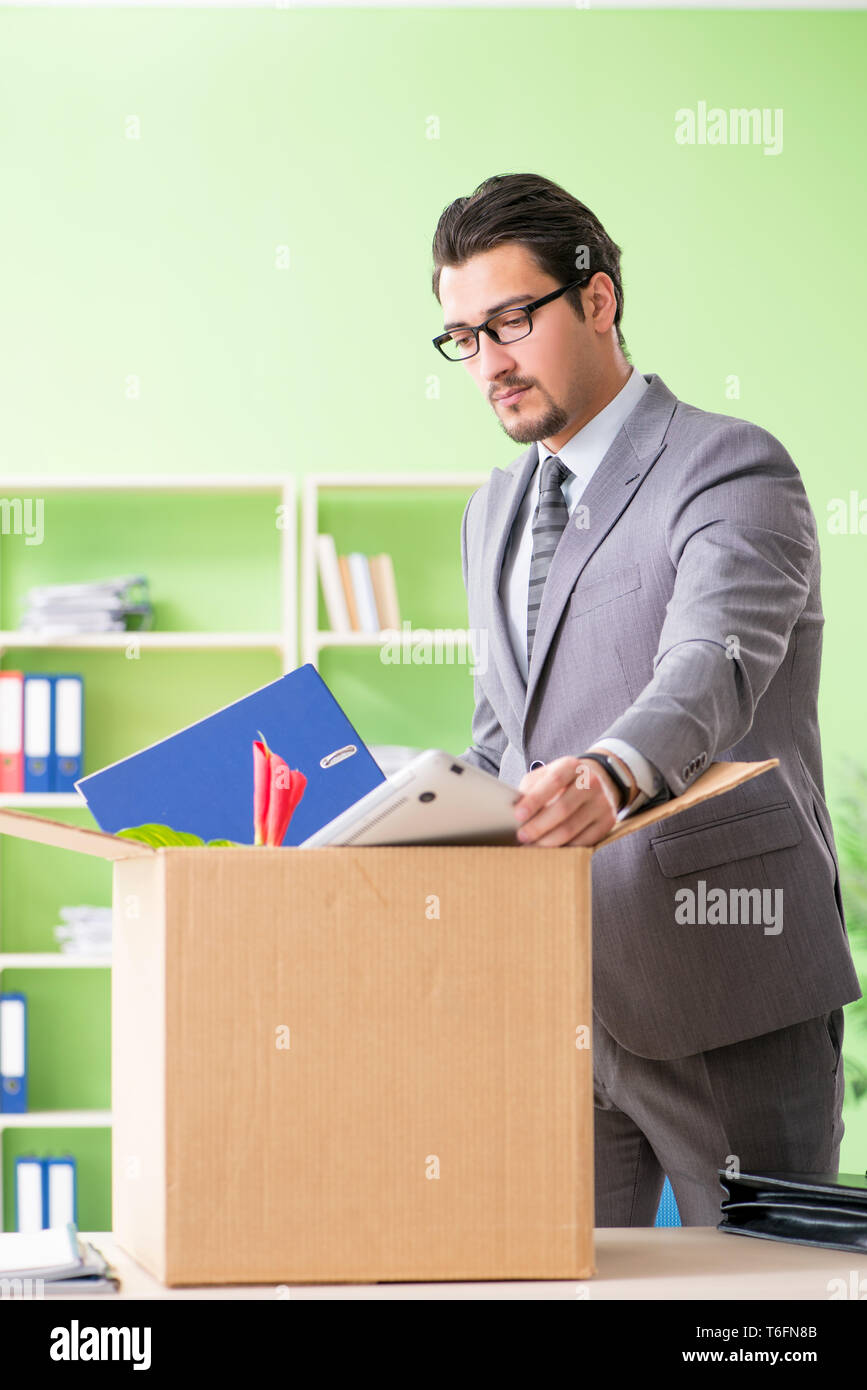 Male employee collecting his stuff after redundancy Stock Photo - Alamy