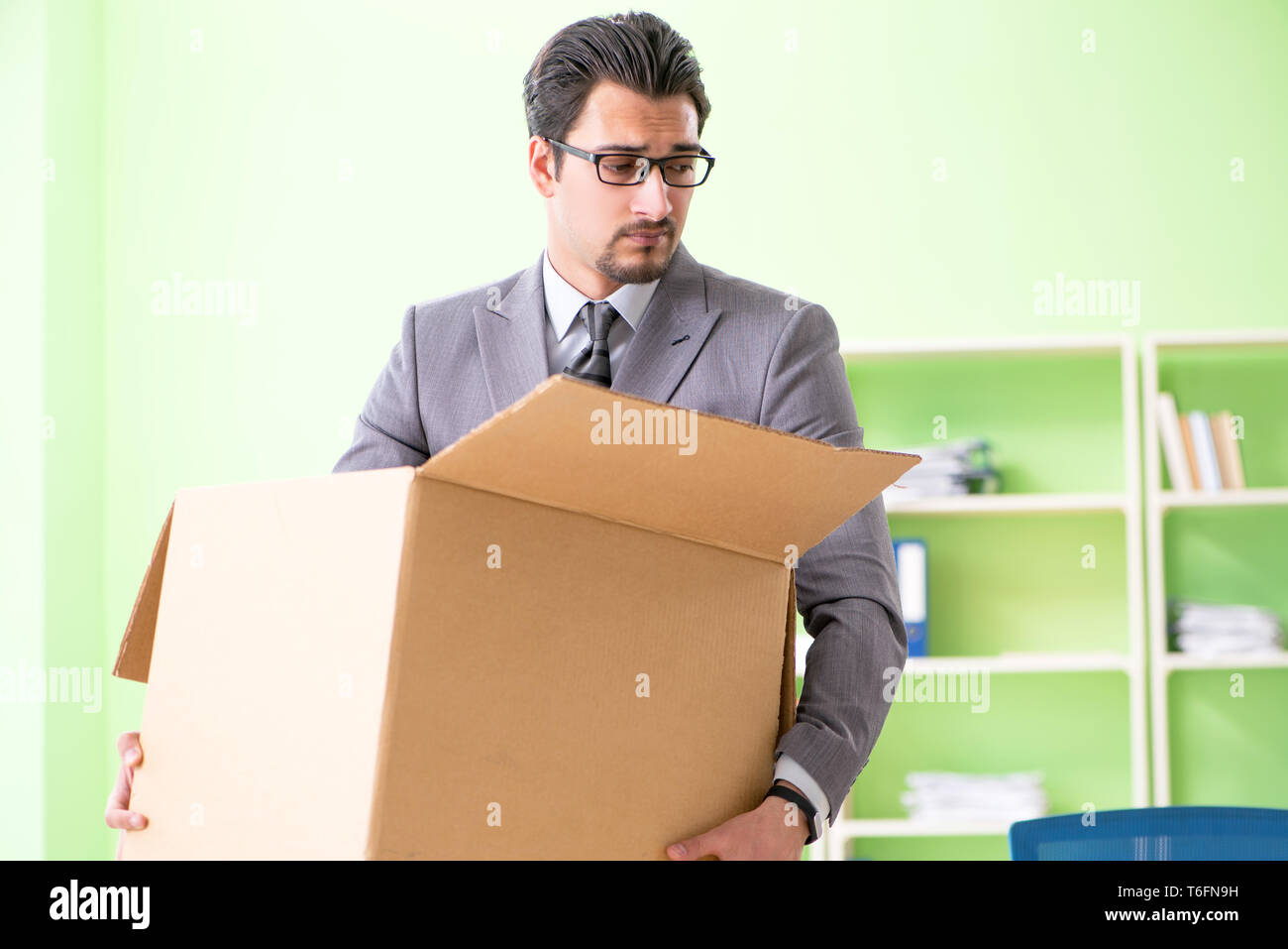 Male employee collecting stuff hi-res stock photography and images - Alamy