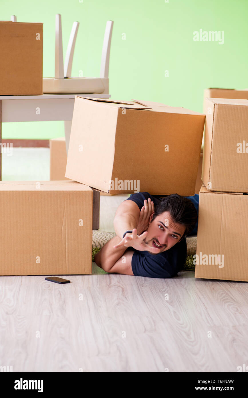 Man moving house with boxes Stock Photo - Alamy