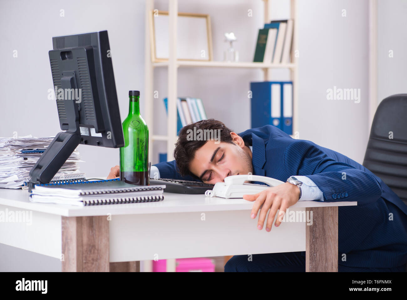 Young drunk employee in the office hi-res stock photography and images ...