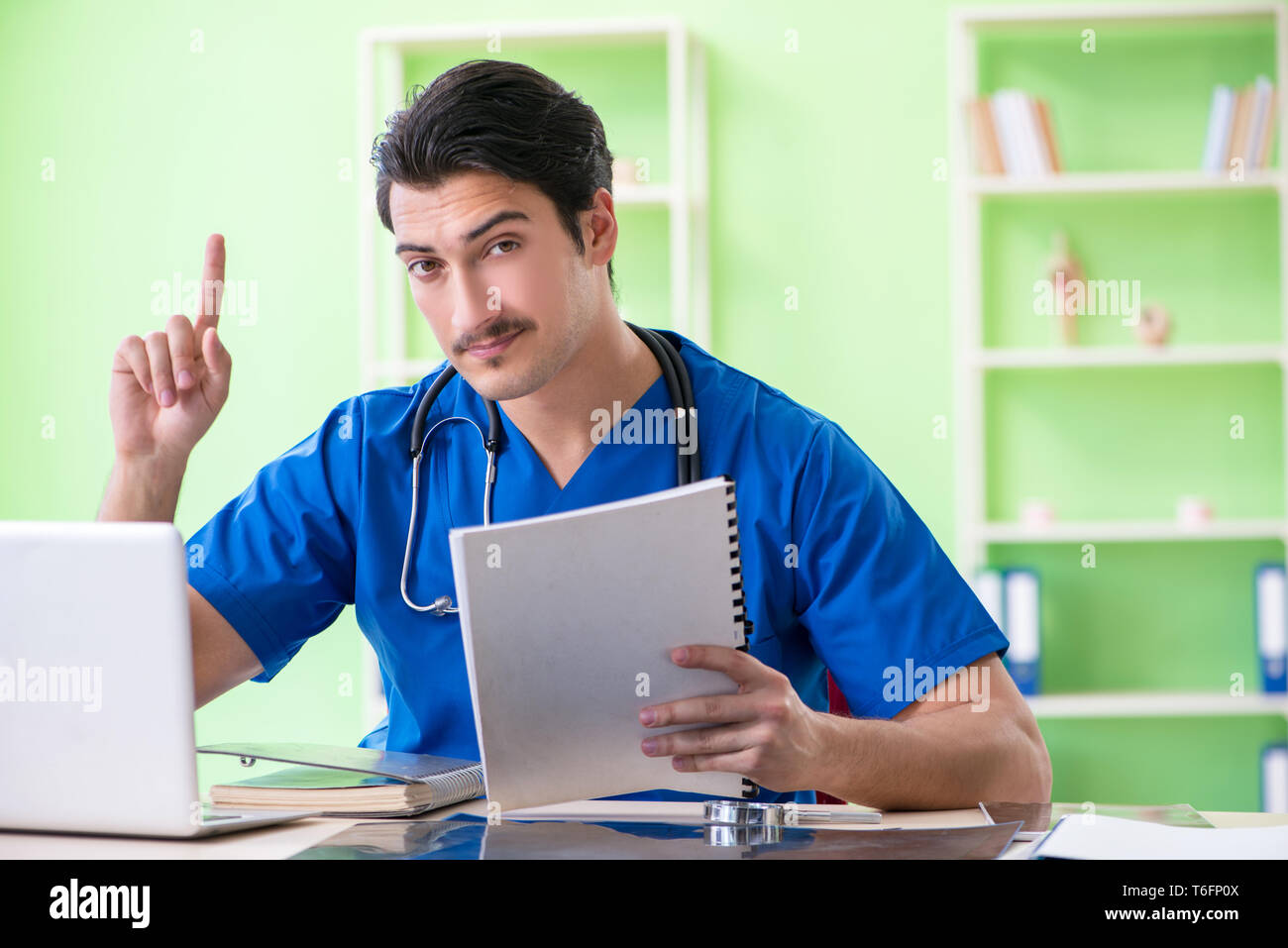 Doctor working computer in bright hi-res stock photography and images ...