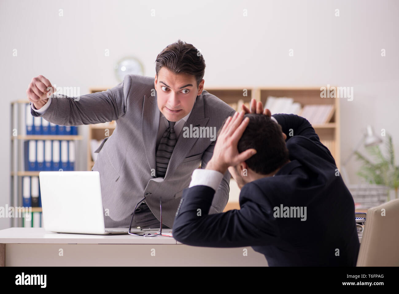 Angry boss shouting at his employee Stock Photo - Alamy