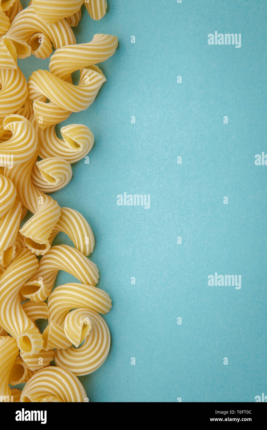 Macaroni pasta on blue hi-res stock photography and images - Alamy