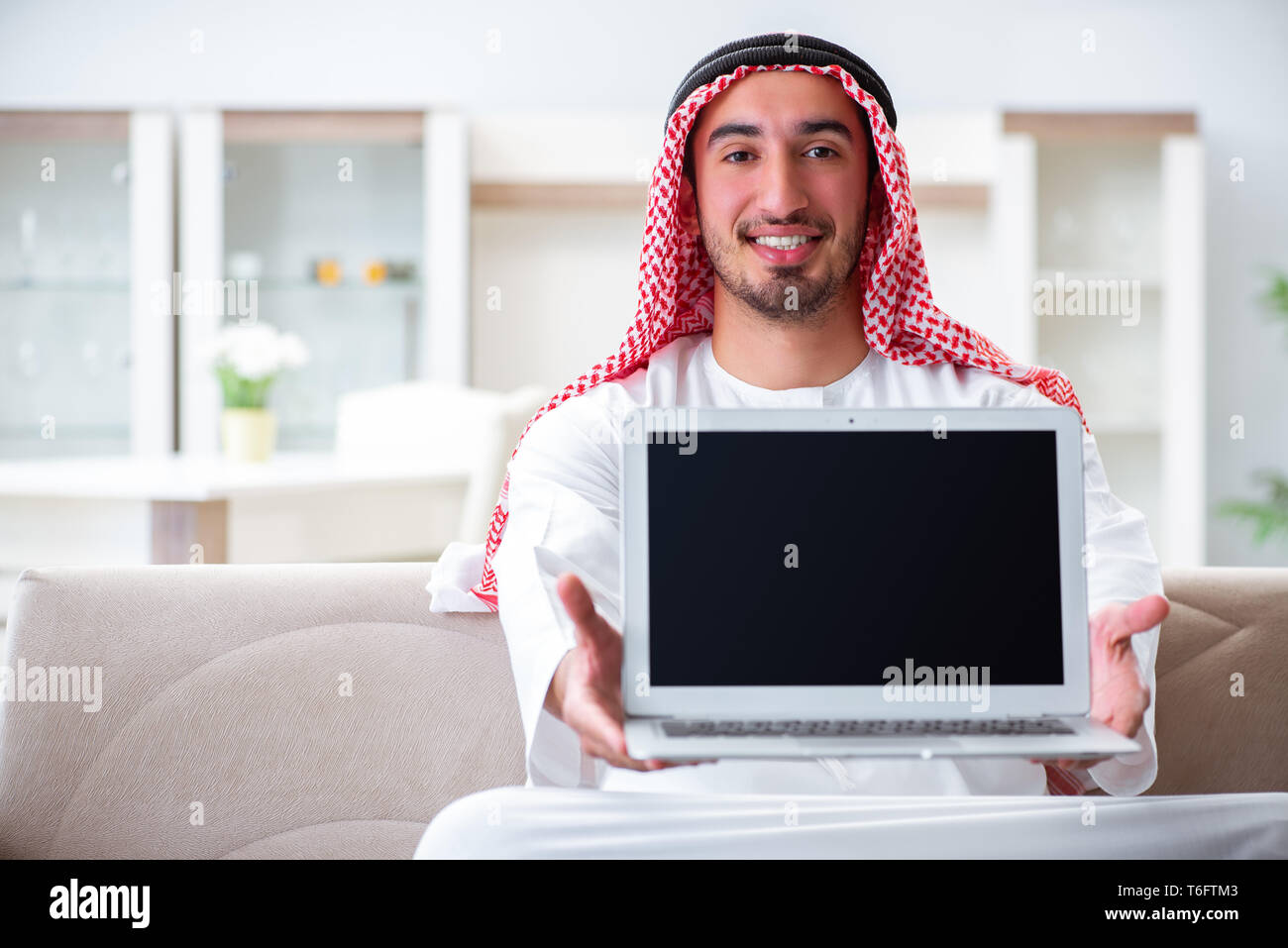 Arab man working at home on his work Stock Photo - Alamy