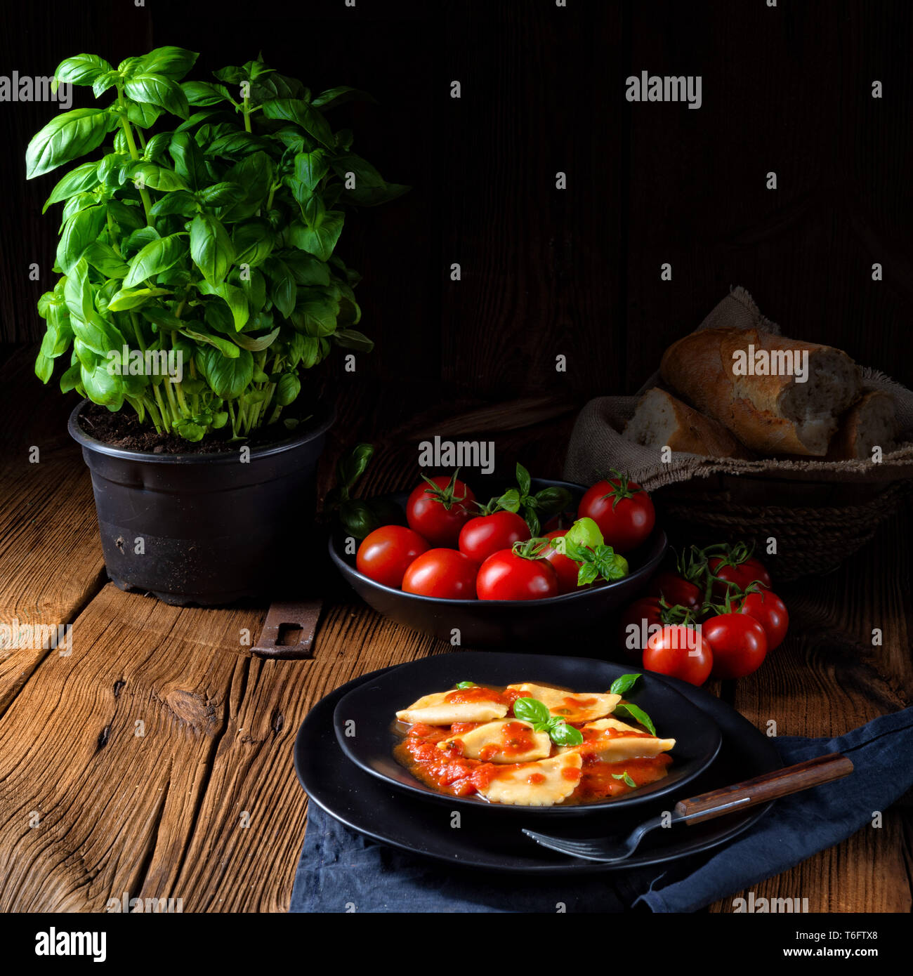 rustic Delicious Pasta - Ravioli in tomato sauce with basil Stock Photo ...