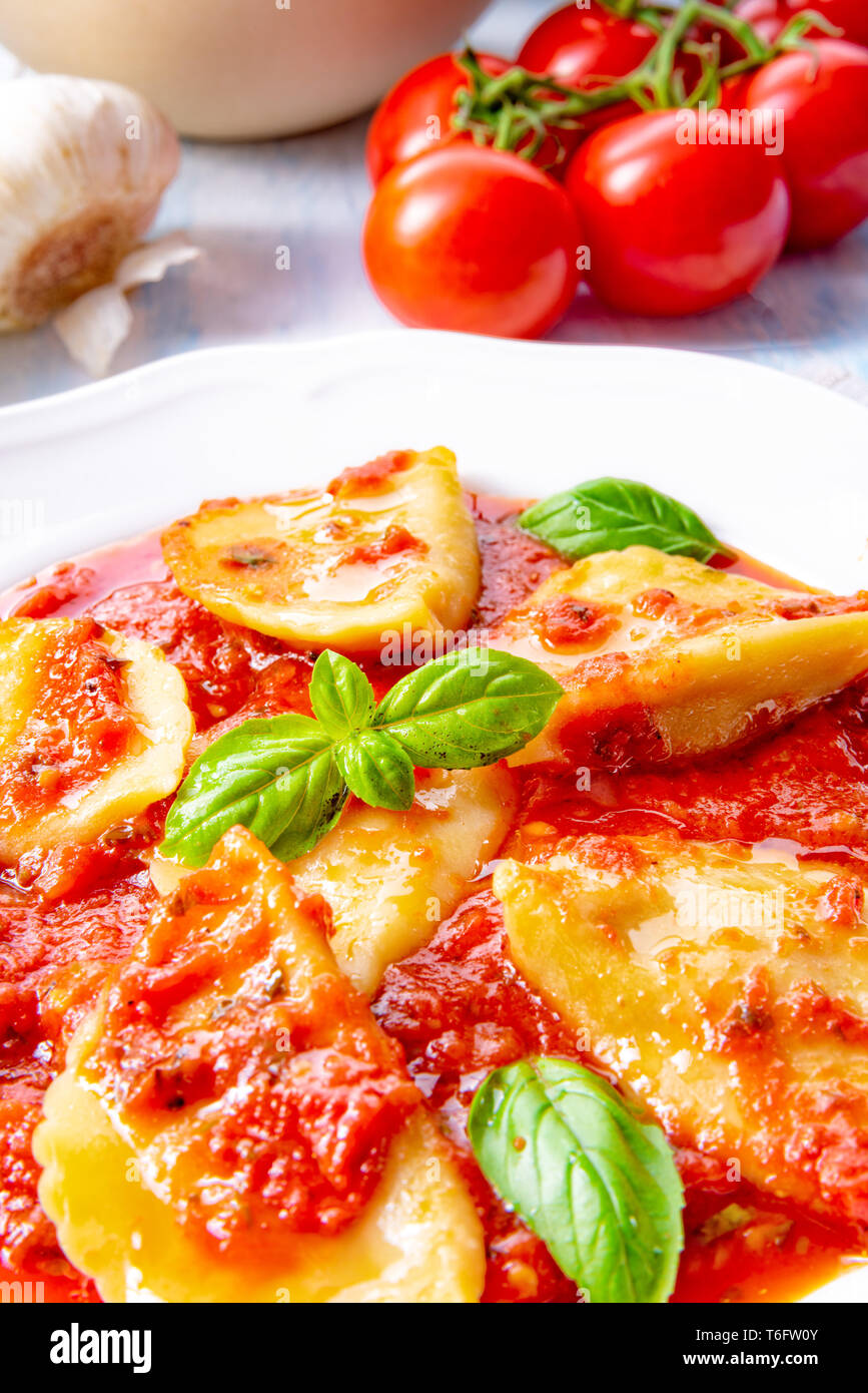 Delicious pasta - ravioli in tomato sauce with basil Stock Photo - Alamy