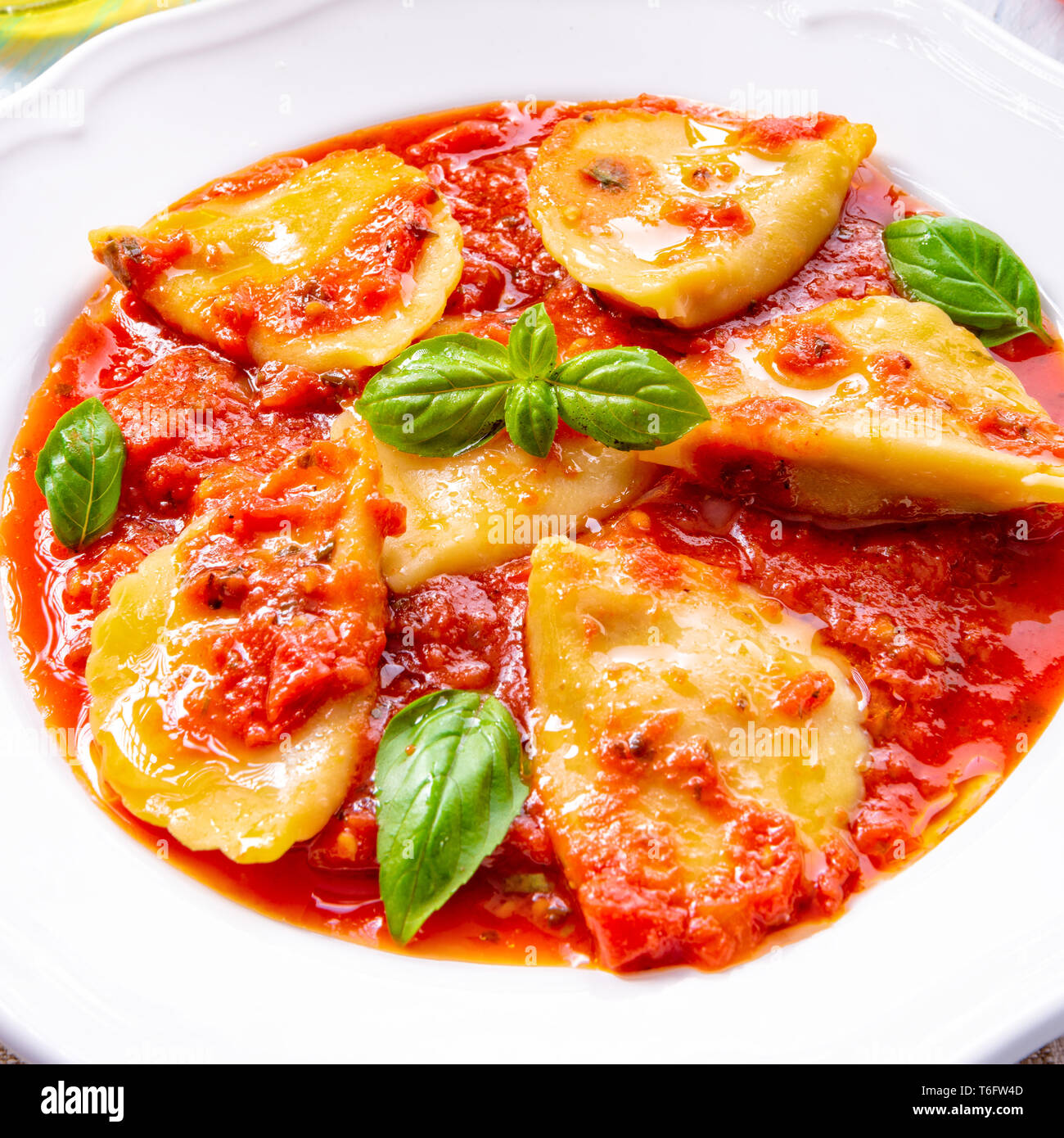 Delicious pasta - ravioli in tomato sauce with basil Stock Photo - Alamy