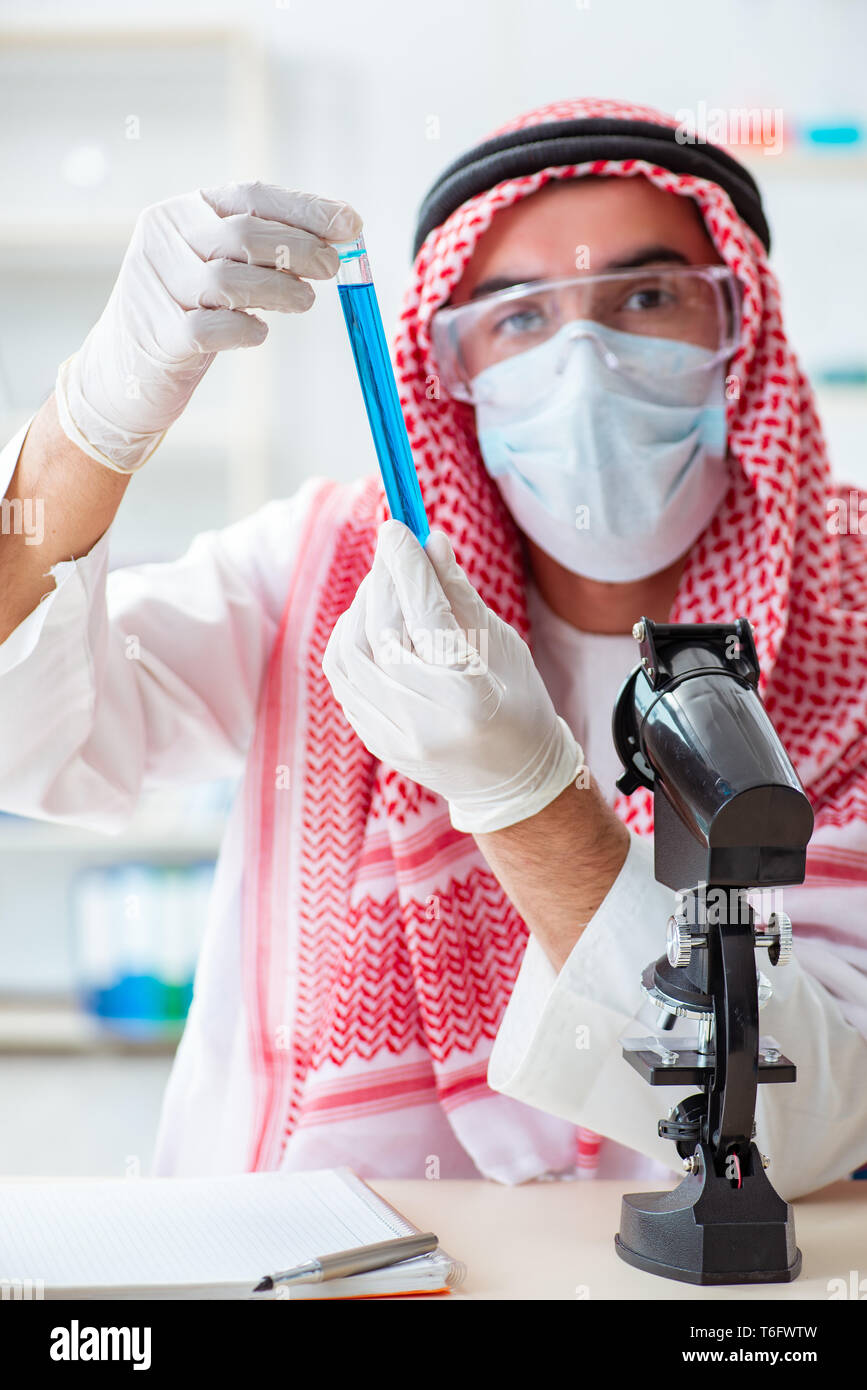 Arab chemist working in the lab office Stock Photo - Alamy