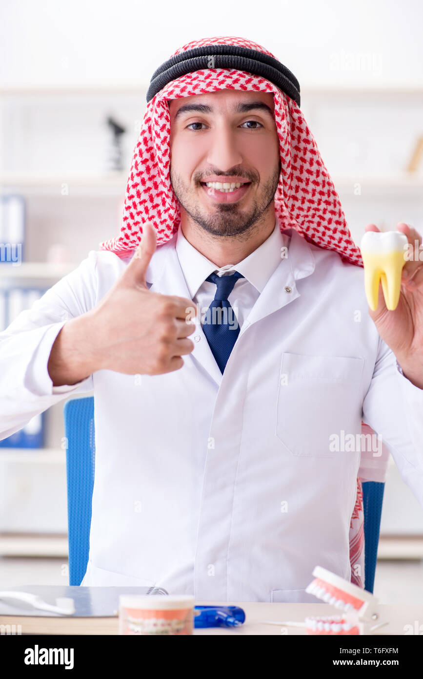 Arab dentist working on new teeth implant Stock Photo - Alamy