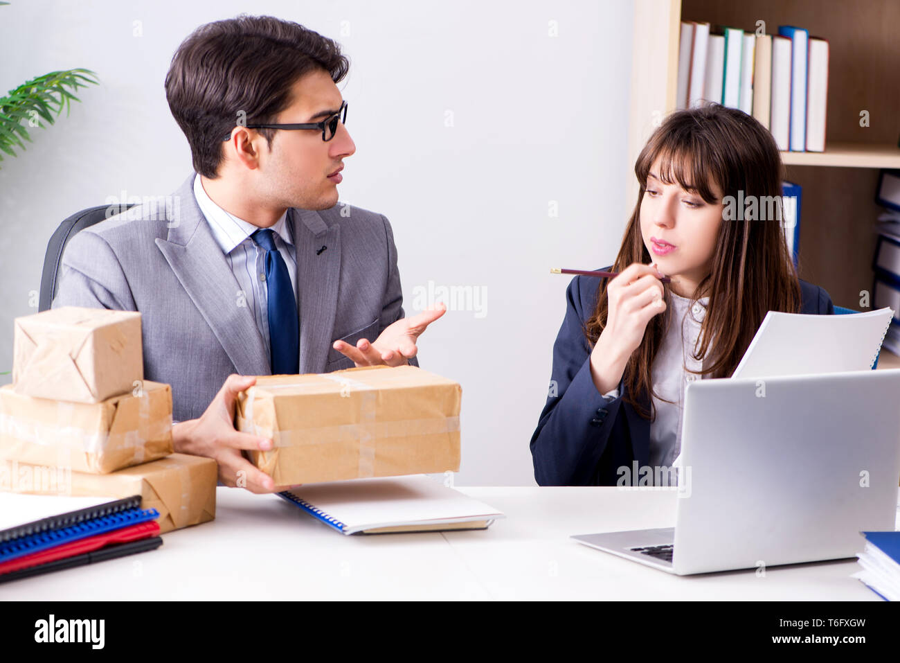 Business people receiving new mail and parcels Stock Photo - Alamy