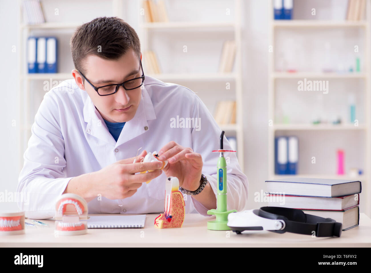 Dentist working teeth implant in medical lab Stock Photo - Alamy