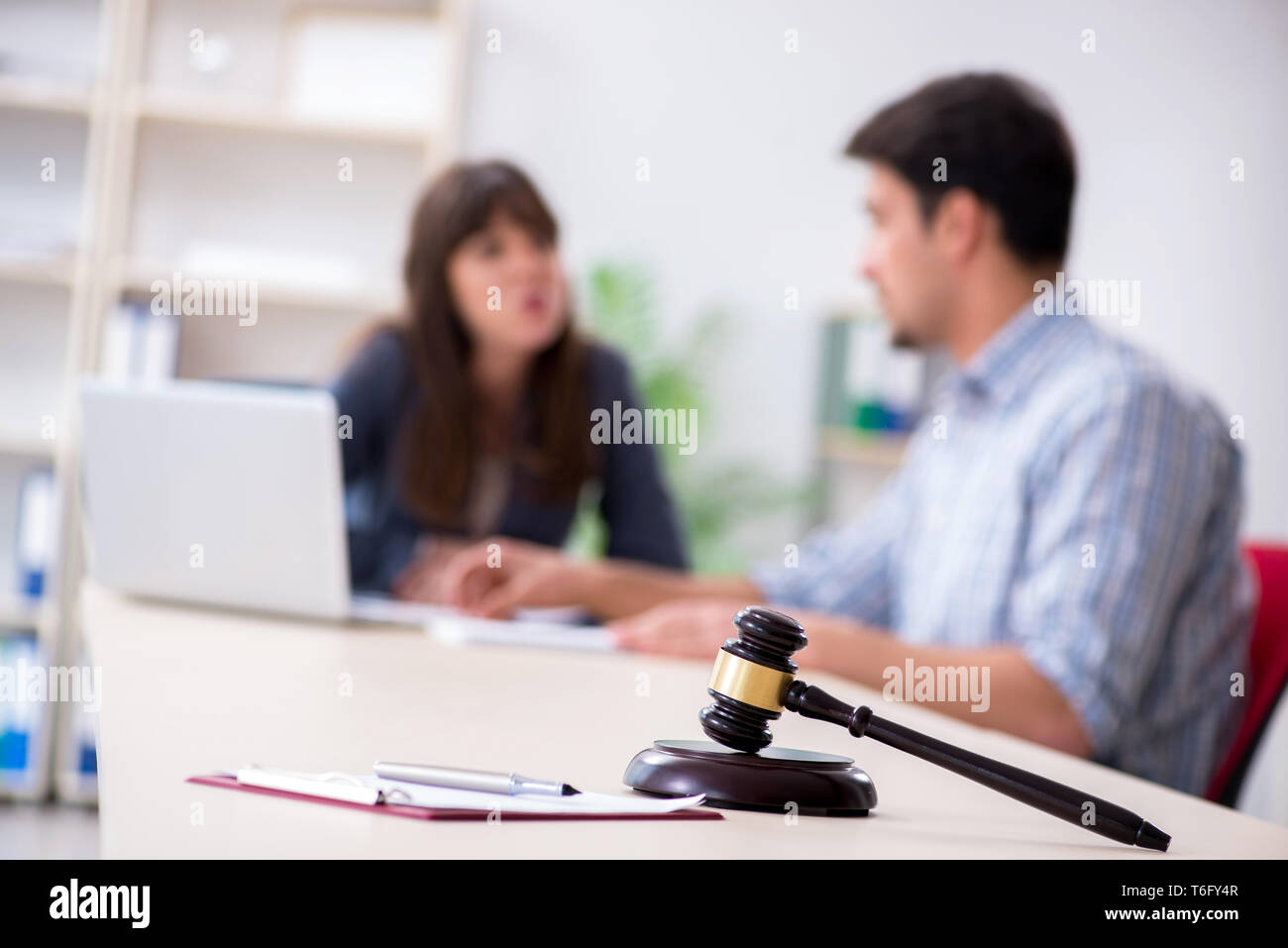 Female lawyer meeting with his male client in the office Stock Photo ...