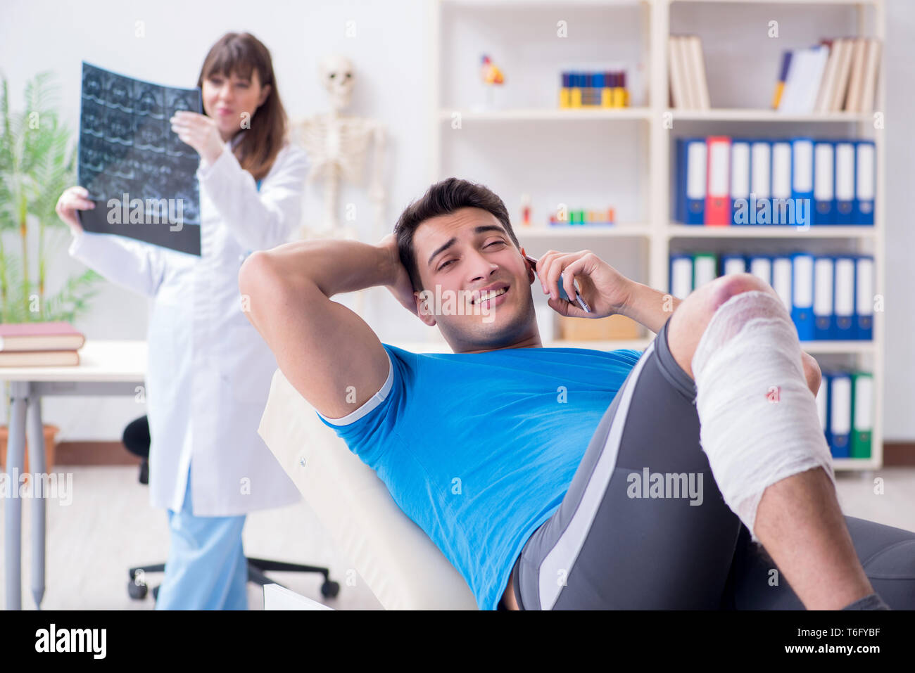Sports player visiting doctor after injury Stock Photo - Alamy