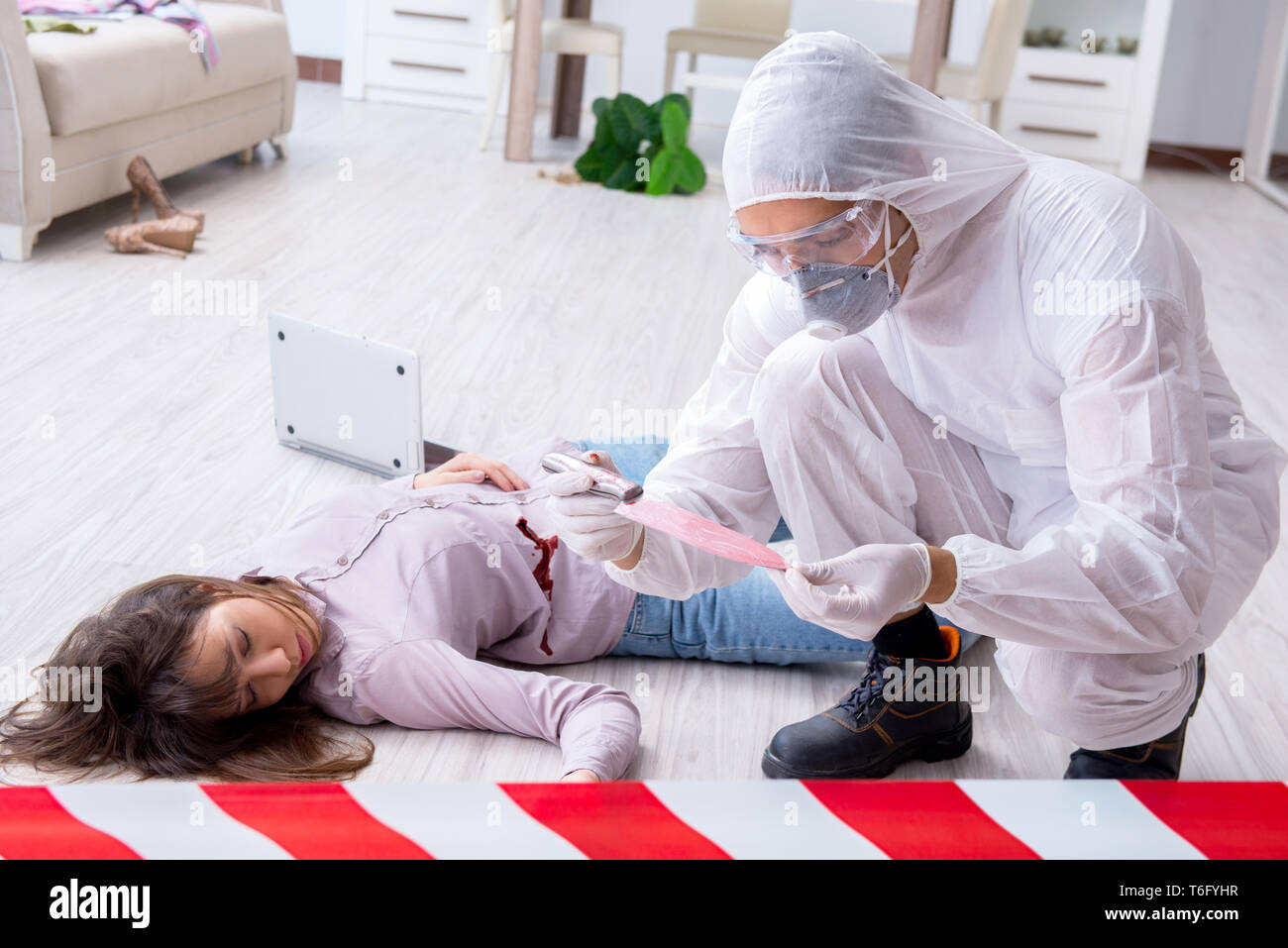 Forensic Investigator At The Crime Scene Investigating Woman Mur Stock