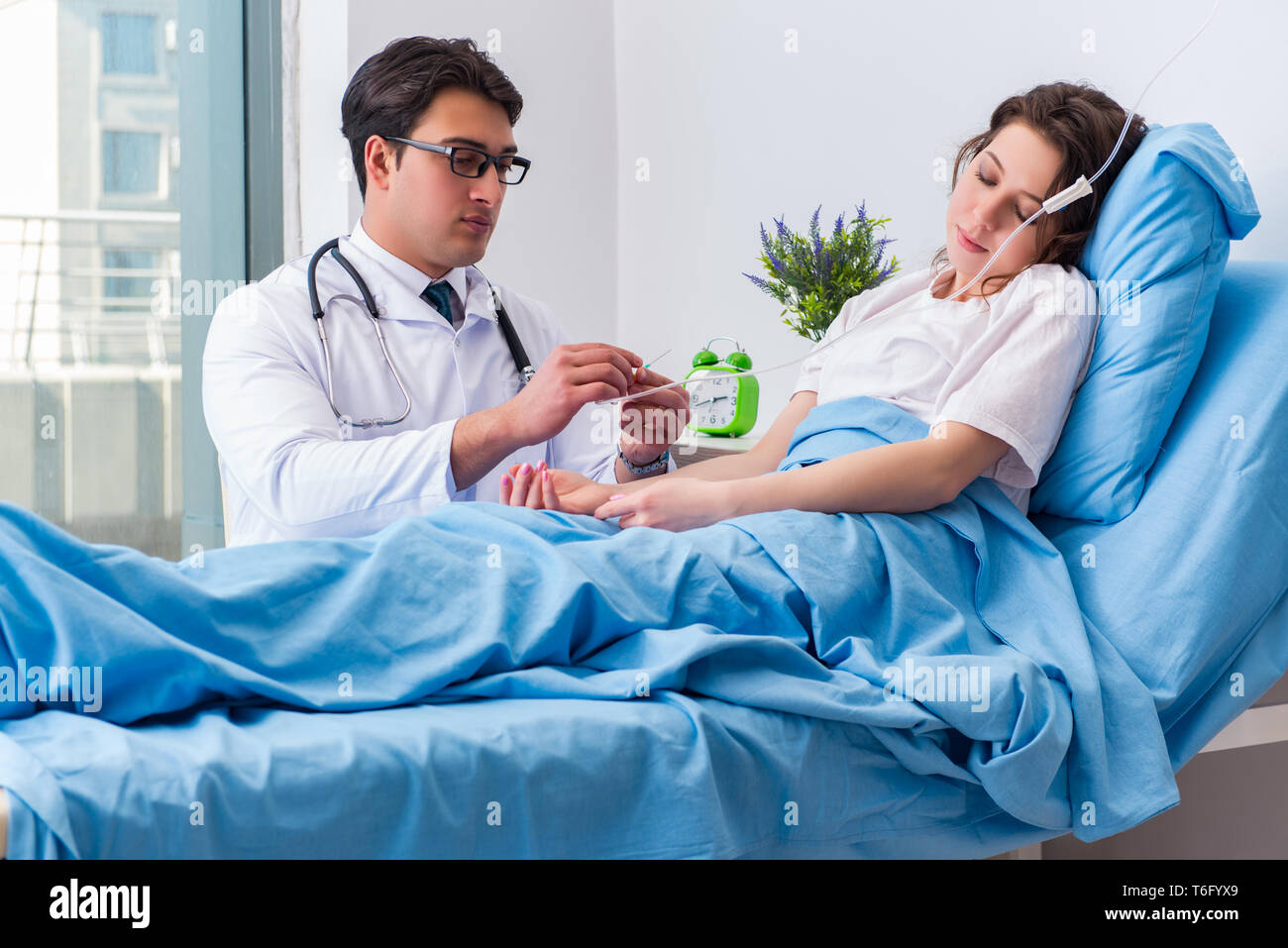 Doctor doing medical injection in hospital room Stock Photo - Alamy
