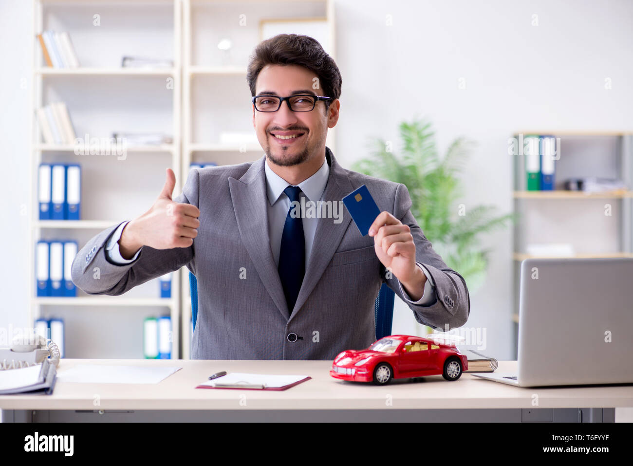 Agent offering car motor insurance Stock Photo - Alamy