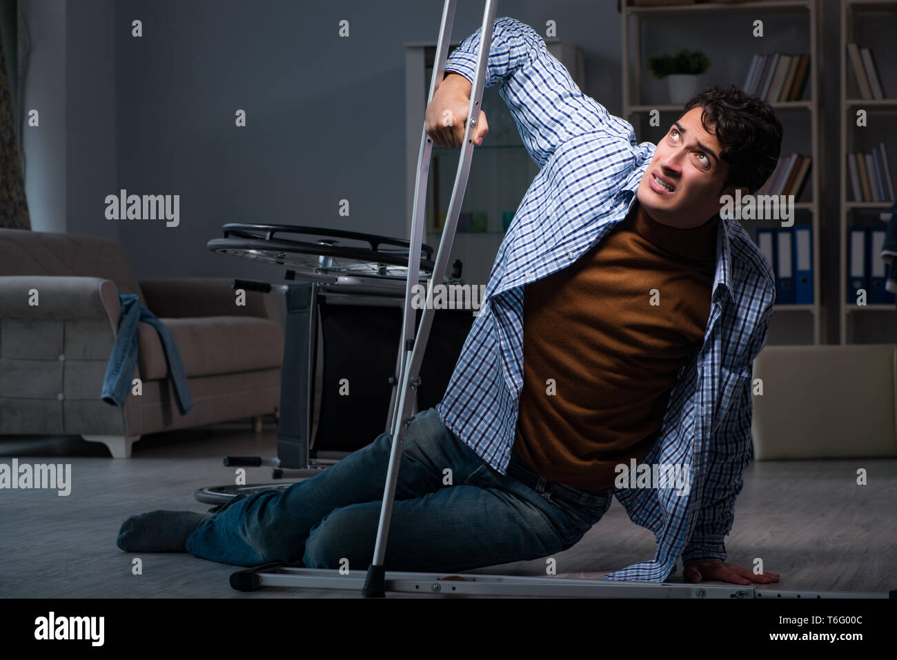 Man falling off chair hi-res stock photography and images - Alamy