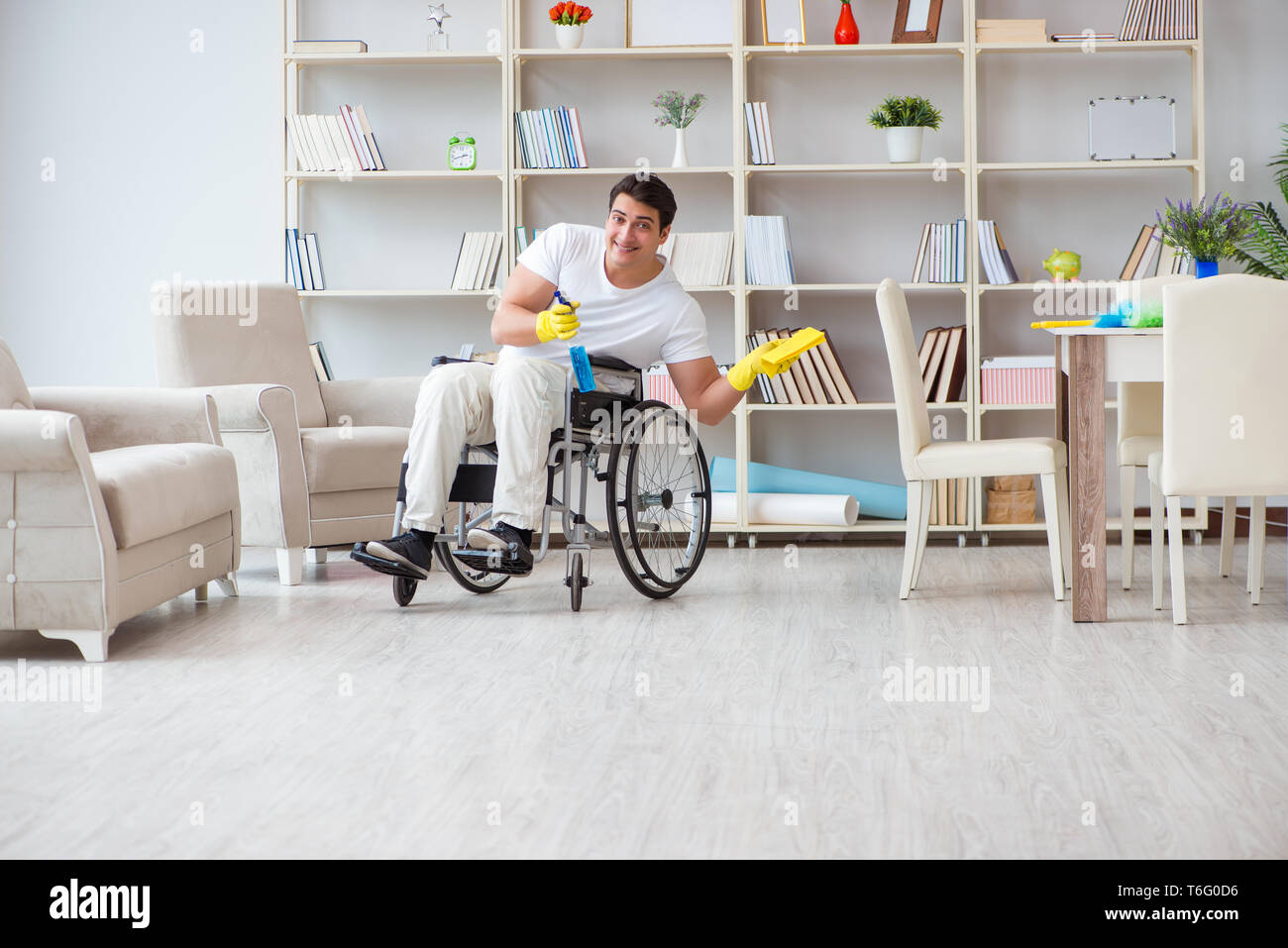 Disabled cleaner doing chores at home Stock Photo - Alamy