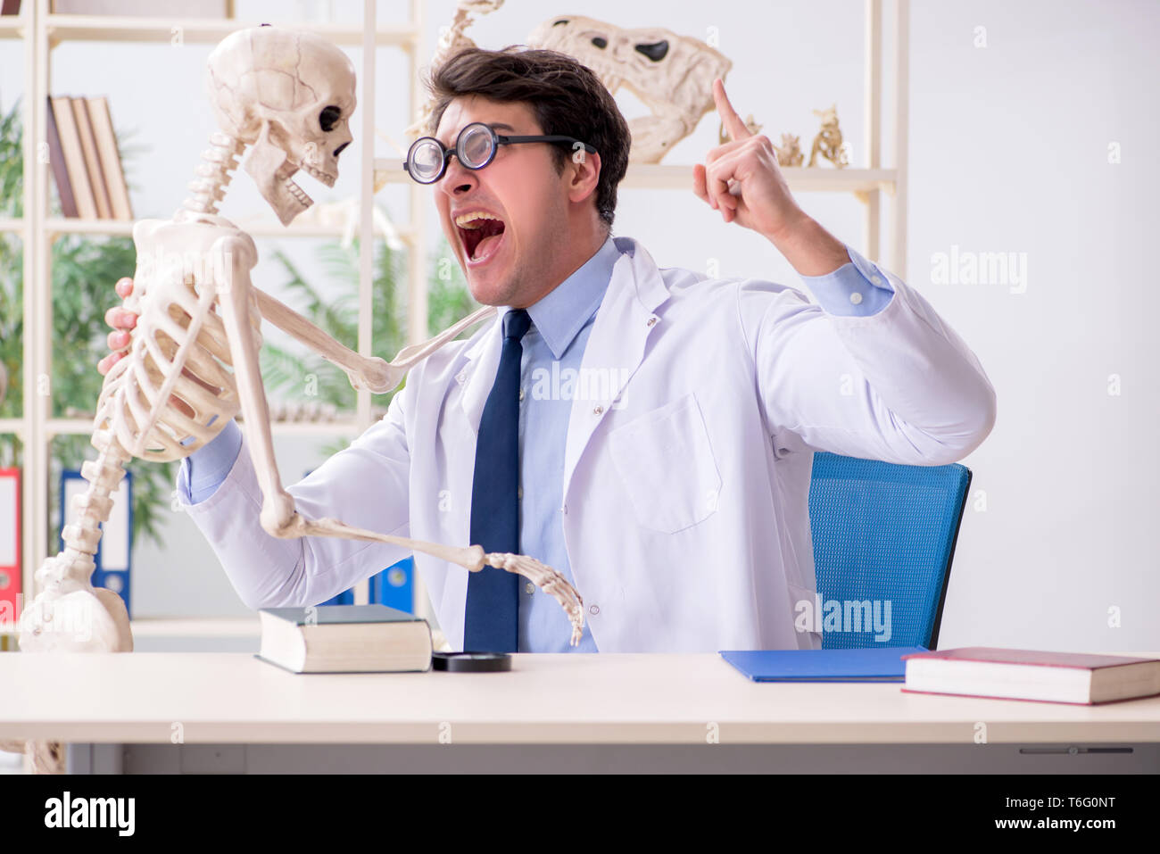 Academic professor studying human skull hi-res stock photography and ...