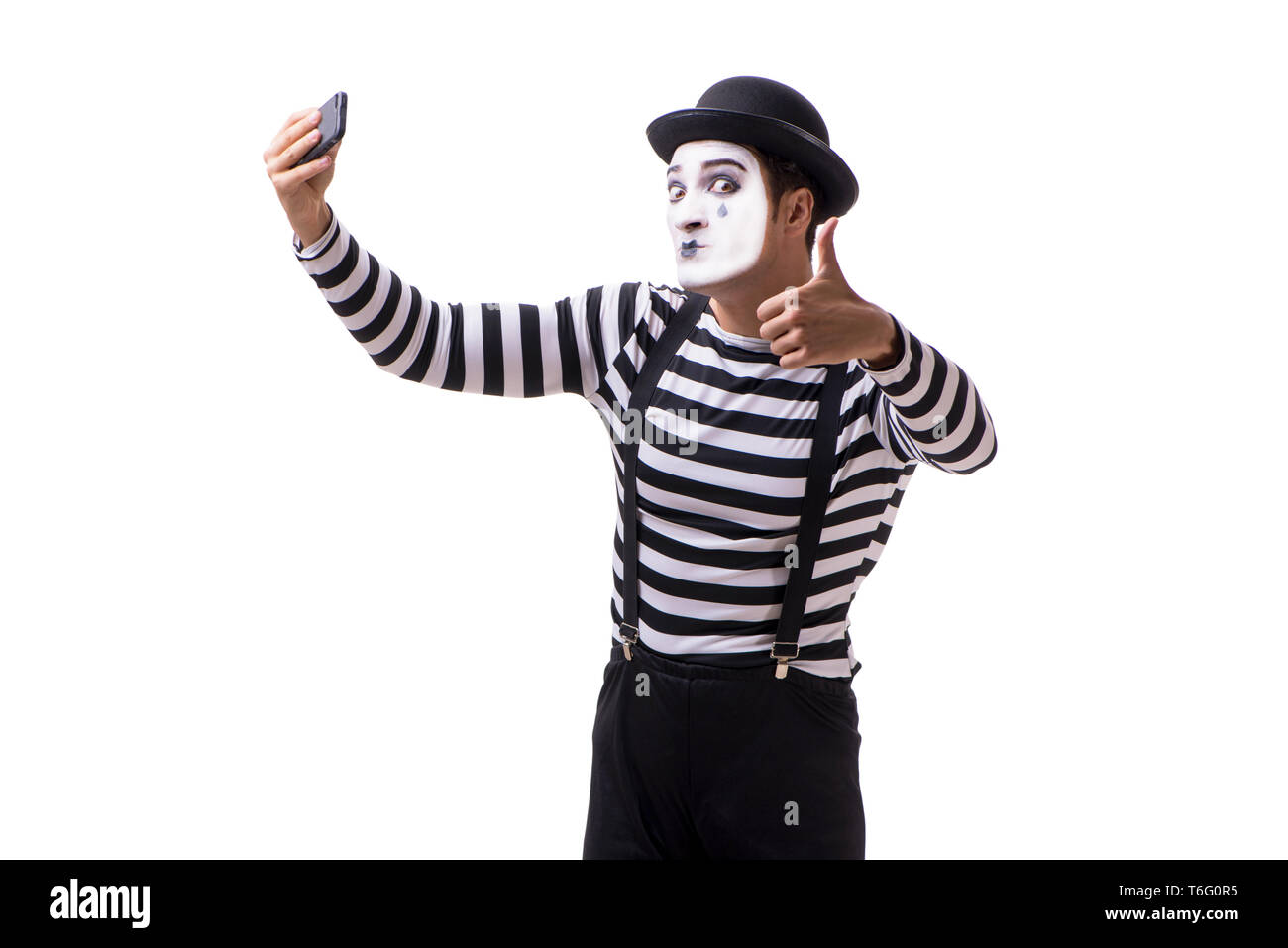Mime with smartphone isolated on white background Stock Photo - Alamy