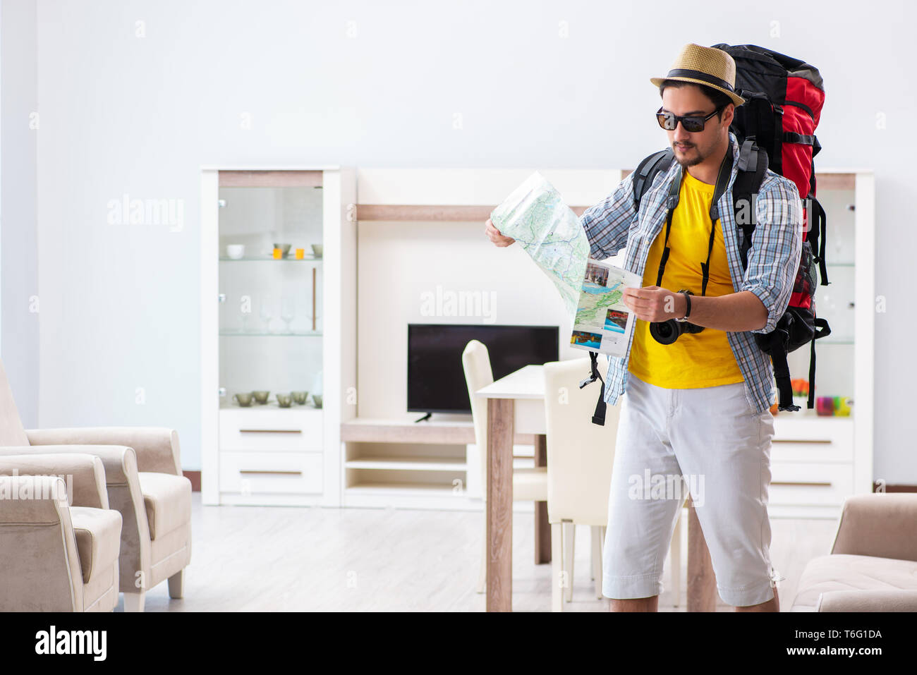 Man planning his travel with map Stock Photo - Alamy