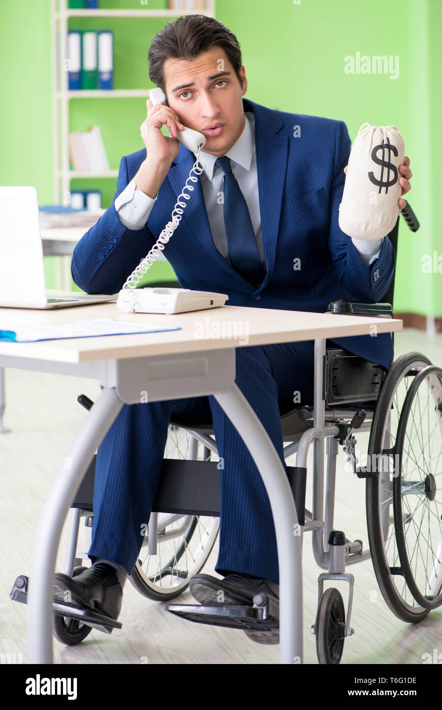 Disabled businessman working in the office Stock Photo - Alamy