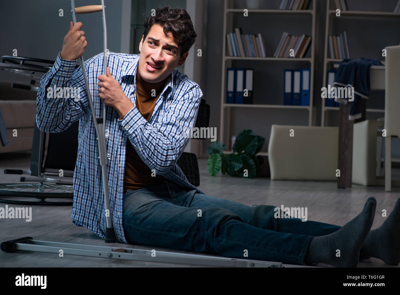 Man falling off chair hi-res stock photography and images - Alamy