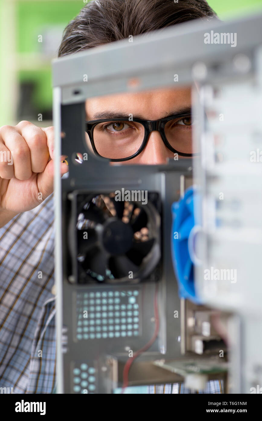 Computer engineer repairing broken desktop Stock Photo - Alamy