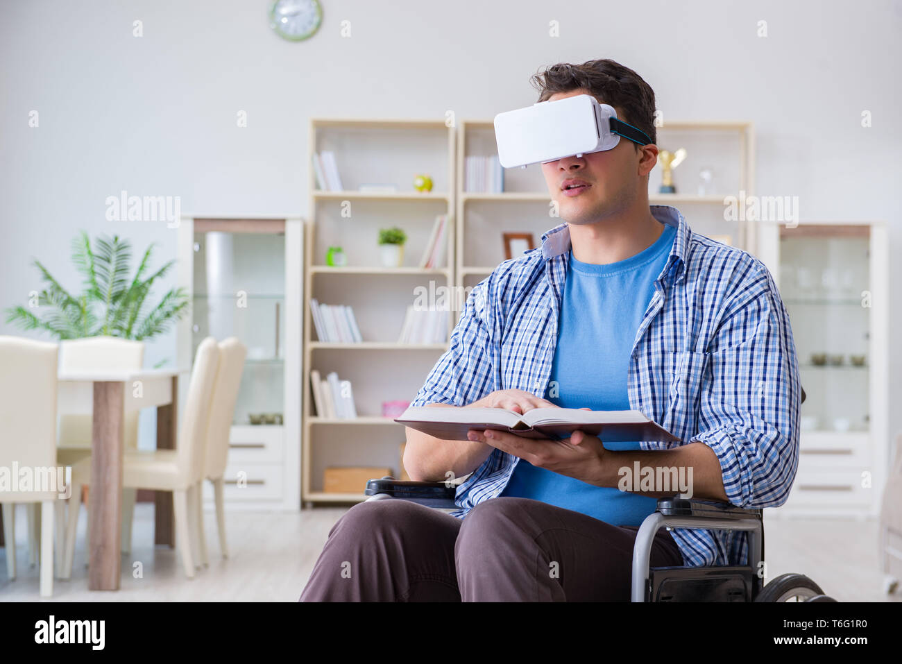 Disabled student studying with virtual reality glasses Stock Photo - Alamy
