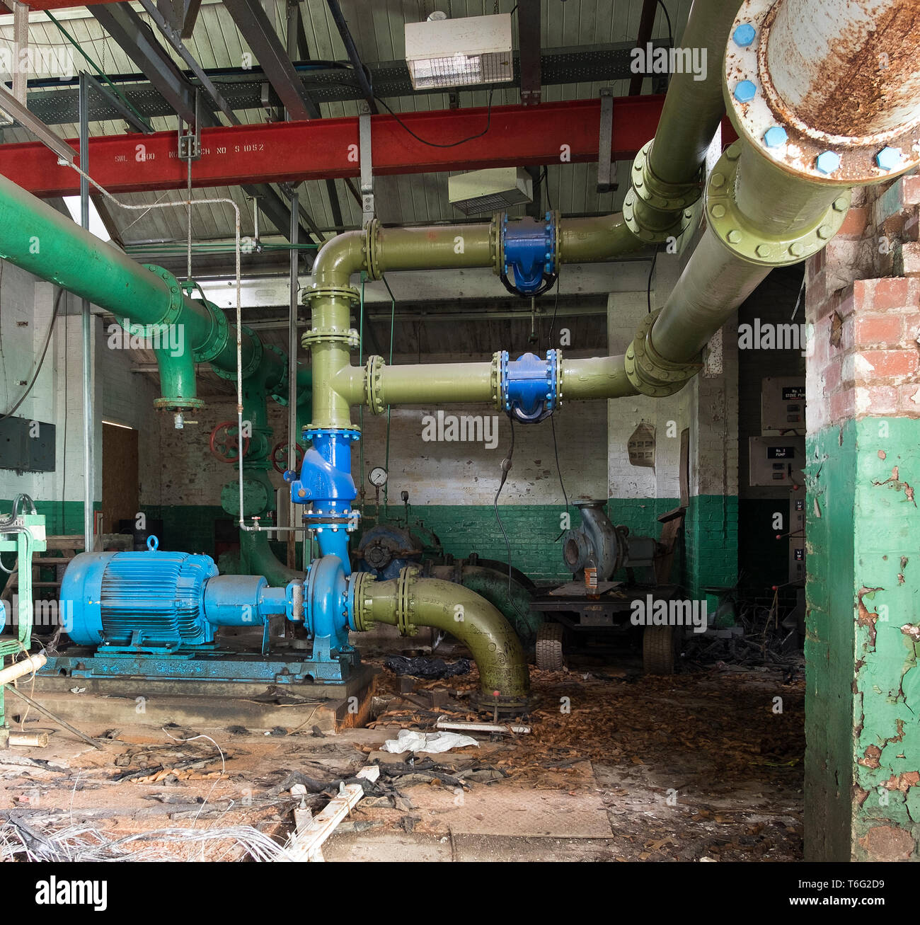Abandoned water pump room interior showing pipework and valves Stock ...
