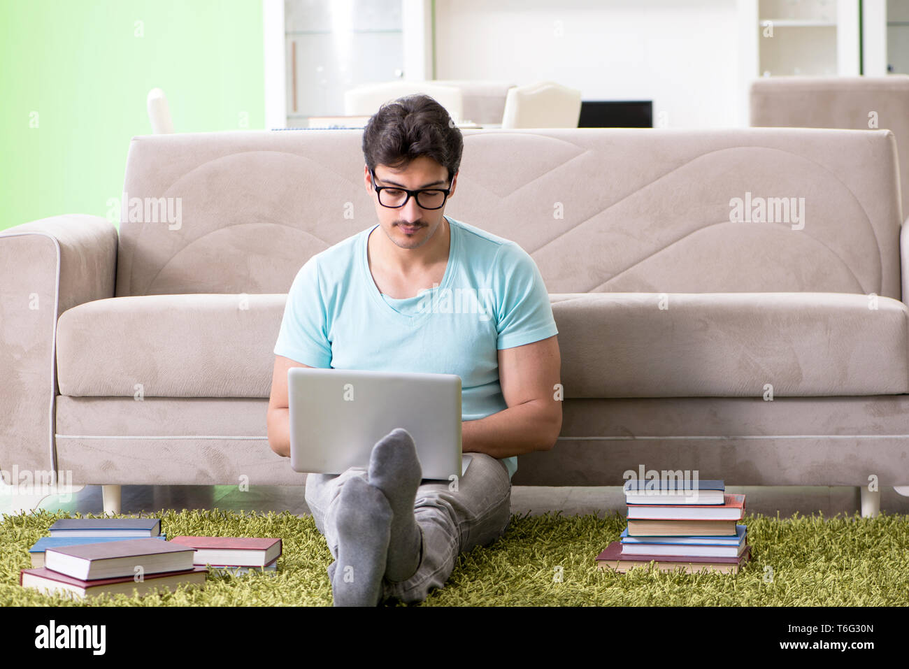 Student preparing for university exams at home Stock Photo - Alamy