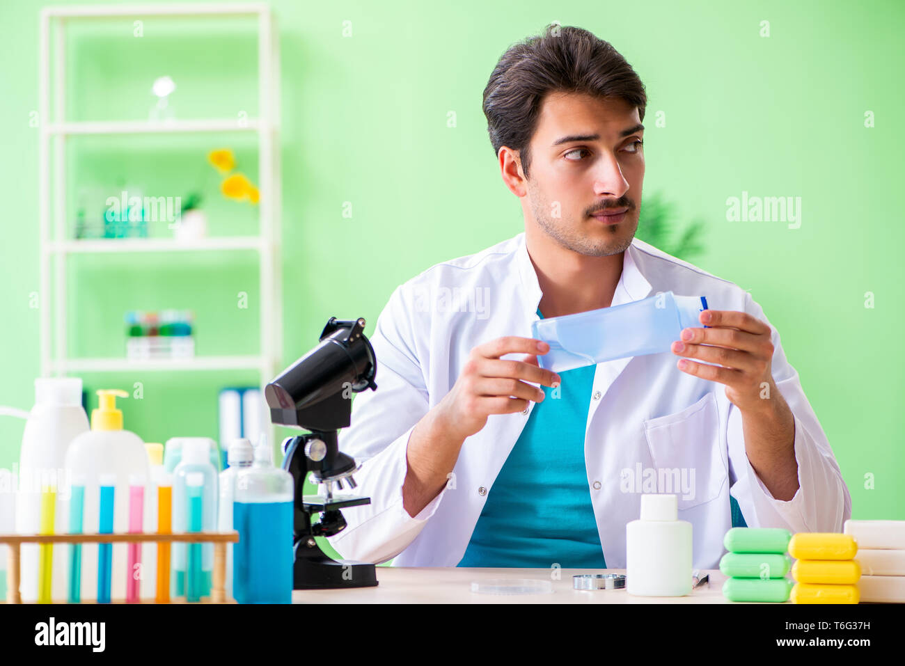 Chemist testing soap in the lab Stock Photo - Alamy