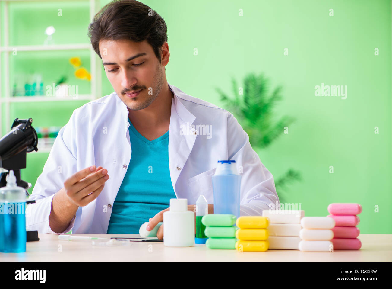 Chemist testing soap in the lab Stock Photo - Alamy