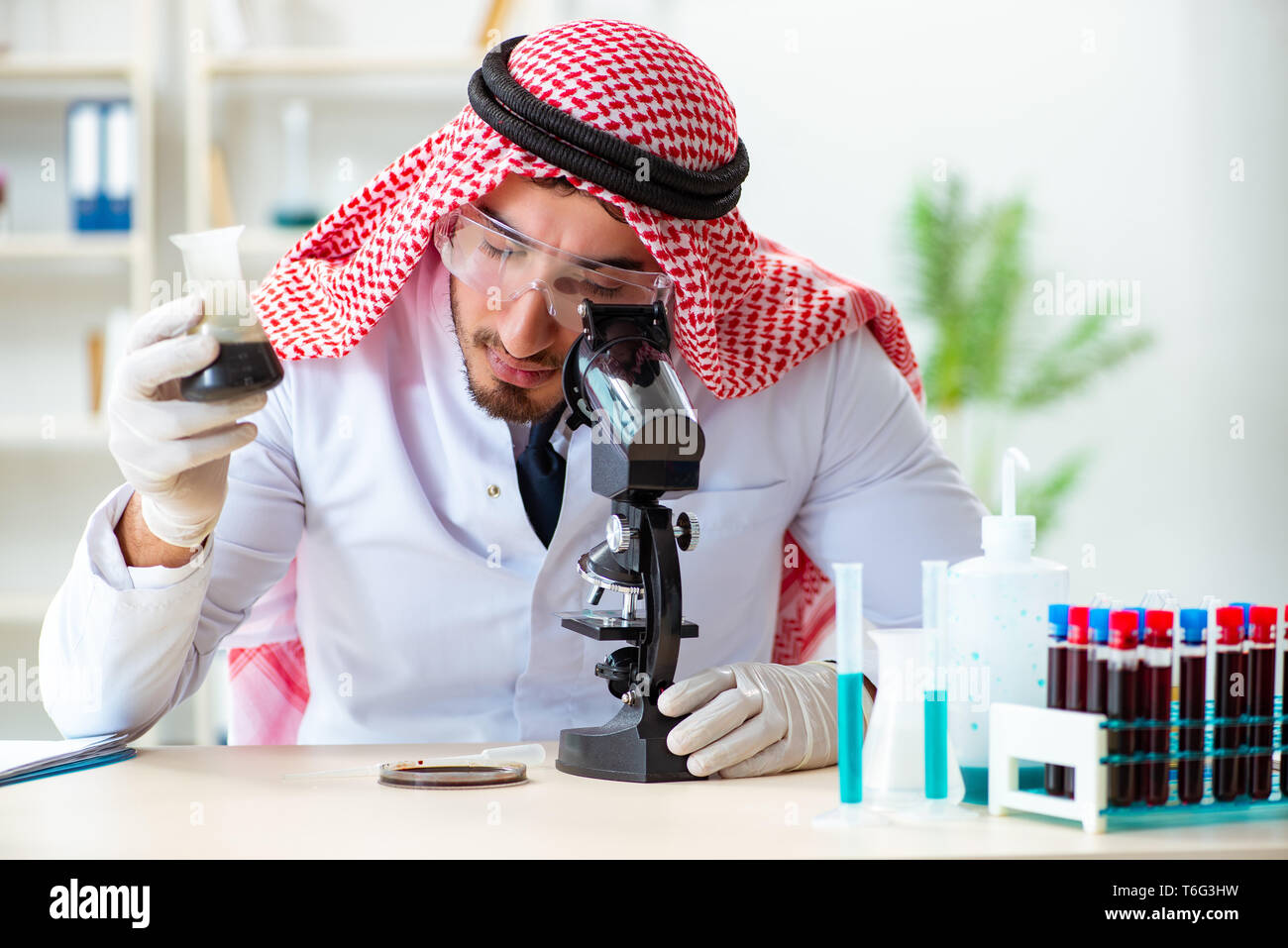 Arab chemist scientist testing quality of oil petrol Stock Photo - Alamy