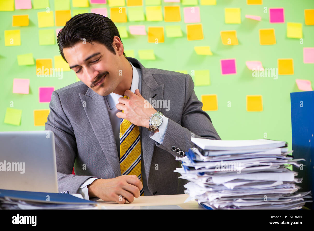 Businessman having trouble with his priorities Stock Photo - Alamy